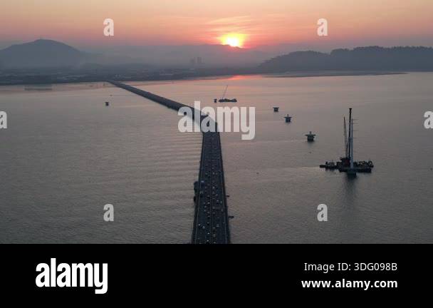 Penang bridge is seen in the distance and the sun is rise Stock Video ...