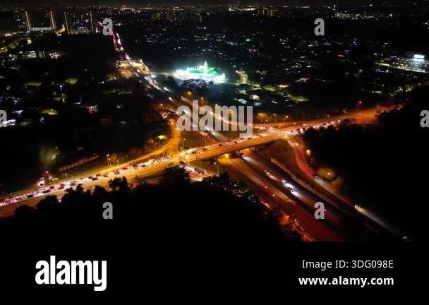 A city street with a large intersection. There are many cars on the ...