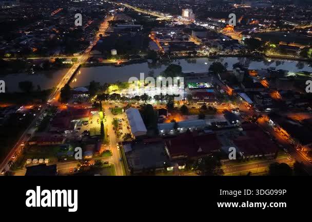 Aerial view Bandar Baharu, Kedah at night with a river running through ...