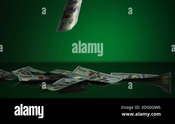 Single one hundred dollar bill floating down onto large pile of money ...