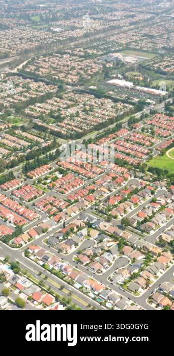 High altitude aerial view of dense suburban housing development with ...
