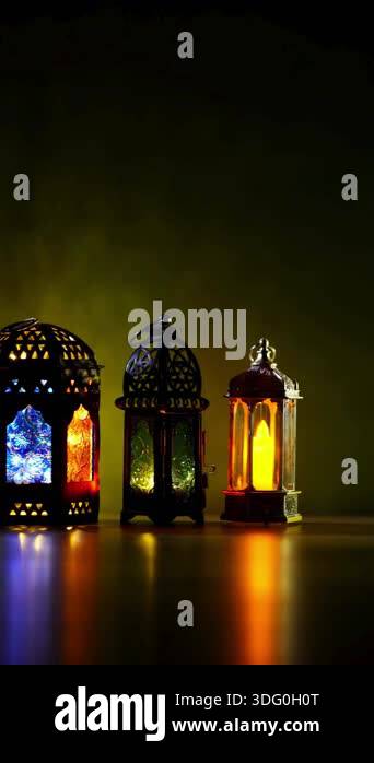 Group of three colorful arabic lanterns on table with dark background ...