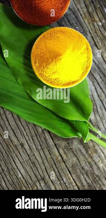 Top view vertical shot of organic turmeric powder and red chili powder ...