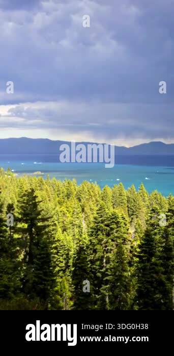 Scenic landscape view of large blue lake surrounded by green pine ...