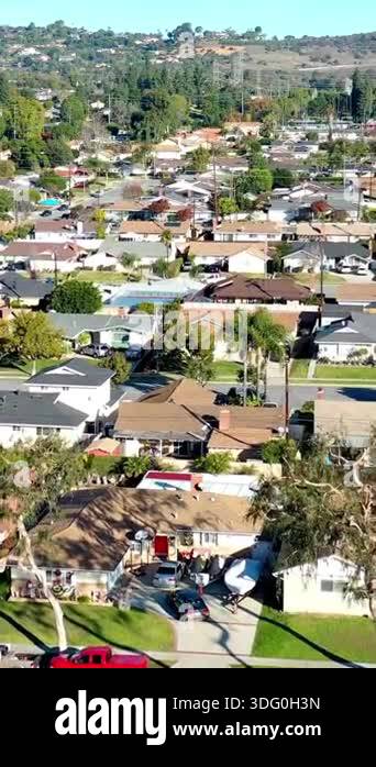High angle aerial shot slowly panning over a vast, dense, affluent ...