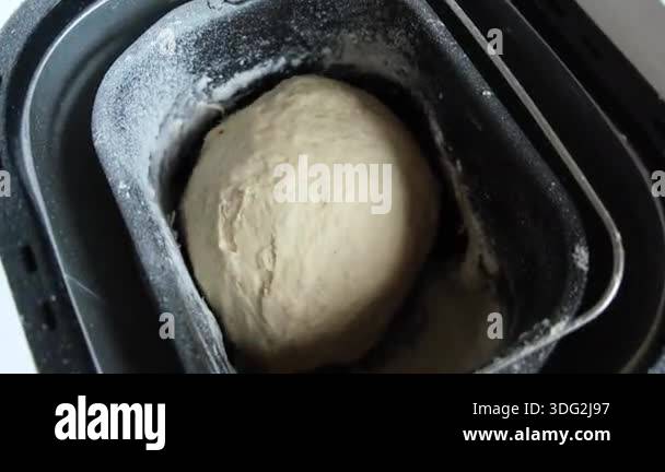 dough being kneaded in a bread maker, close-up. High quality 4k footage ...
