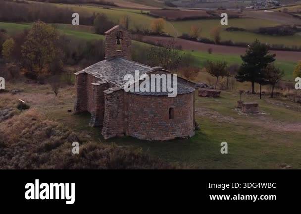 Romanesque stone mountain hermitage church in the Pyrenees. Aerial view ...