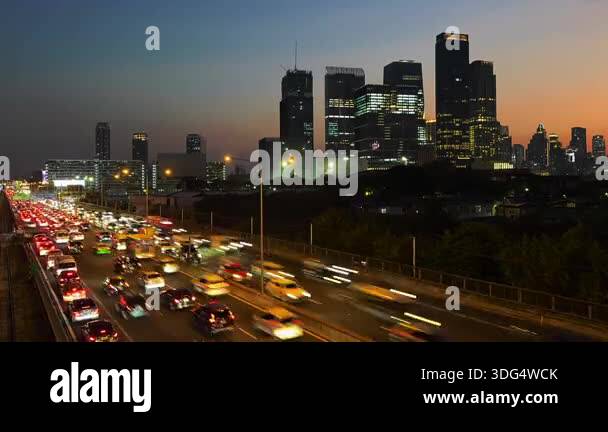 Traffic timelapse in city at sunset background Stock Video Footage - Alamy