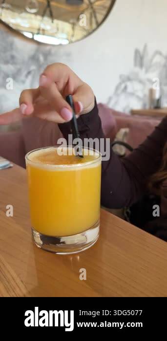 I pour orange juice with pulp from the pitcher and then place it back ...