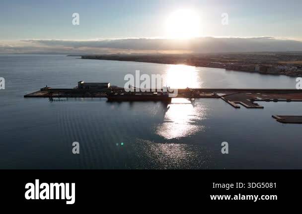 Drone aerial view of Torrevieja port with cargo ship harbor pier and ...