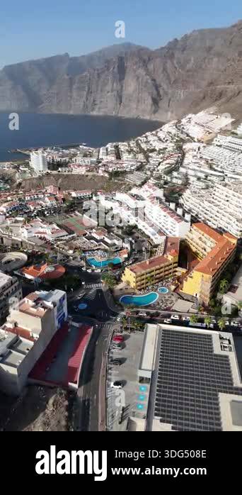 Aerial view of Los Gigantes resort town and famous cliffs in Tenerife ...