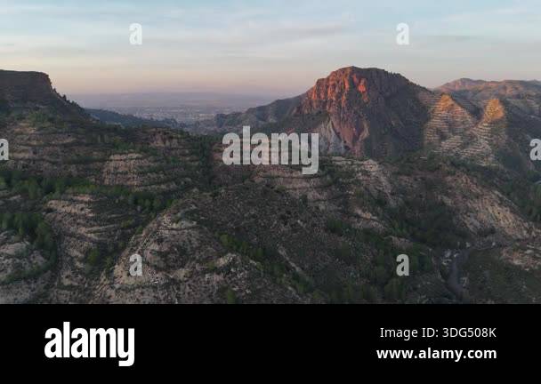 Aerial drone view of Cresta del Gallo mountain ridge at golden hour ...