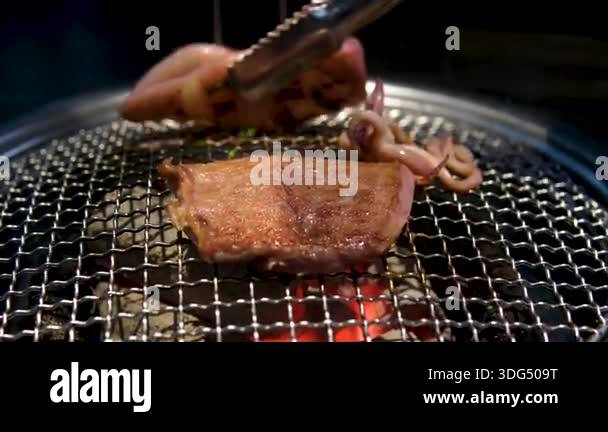 Top-down view of beautifully marbled raw Hanu beef slices, mushrooms ...
