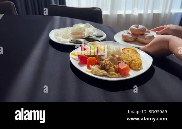 Buffet in the hotel, restaurant. People go to the table and pick up ...