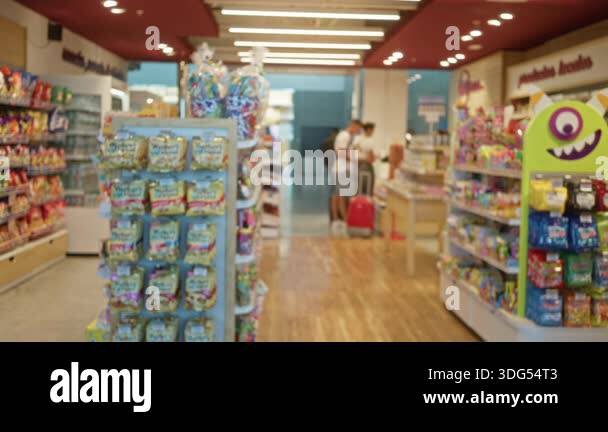 Blurred retail shop interior shot with soft bokeh and defocused shelves ...
