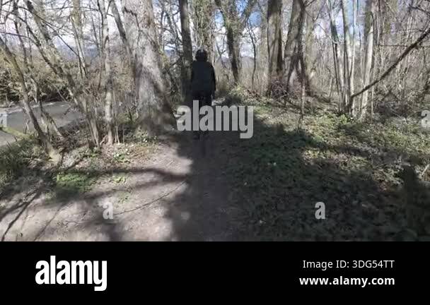 First person bicycle ride through woodland with river views, strong ...