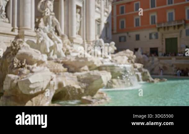 Blurred outdoor fountain background with soft bokeh and defocused stone ...