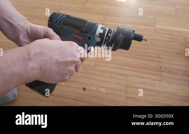 Warm angled shot showing right side of cordless electric drill driver ...