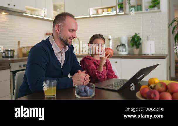Happy family father and daughter are talking on a video call on a ...