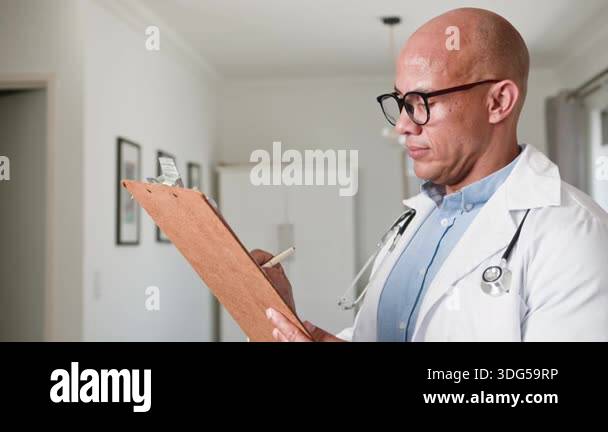 Professional bald male doctor wearing glasses, a lab coat, and a ...