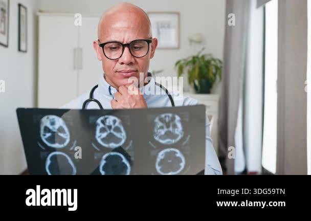 Focused medical professional meticulously examines a detailed brain ...