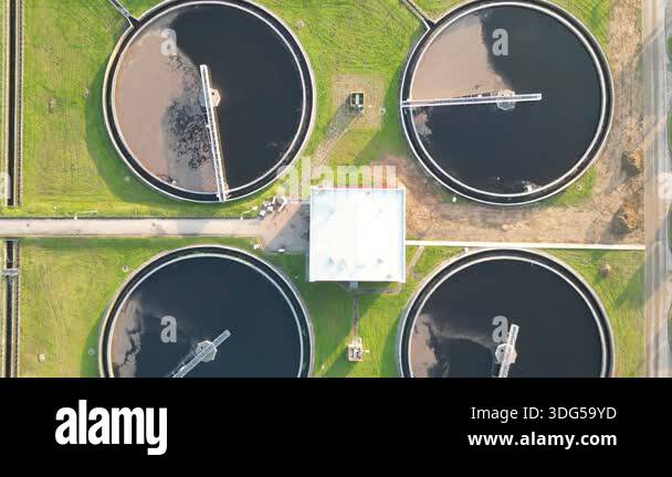 Aerial view of water treatment facility showcasing circular tanks and ...