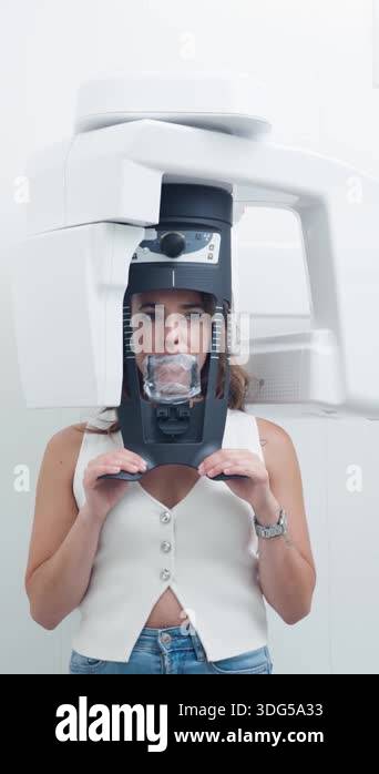 Young womans face during a panoramic dental x-ray. Advanced tomography ...