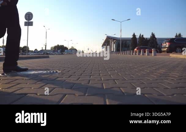 Low angle view of unrecognizable confident businessman walking on city ...