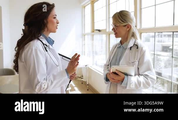 Two women therapists in uniforms lead professional or personal ...