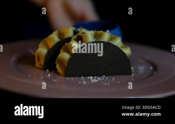 Close up of chocolate cream flows on freshly baked chocolate cake with ...