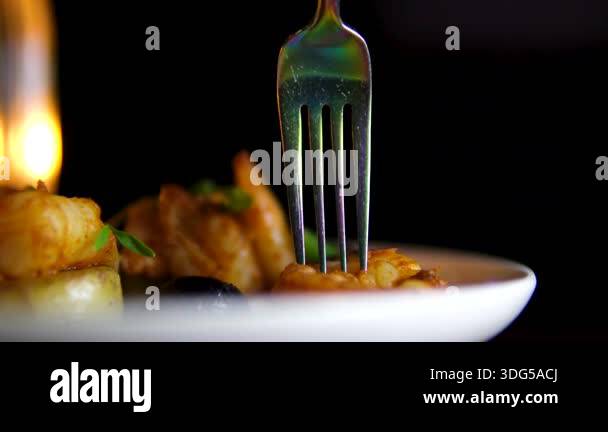 Eating Rare Cooked Beef Steak With Fork And Steak Knife, Served With ...