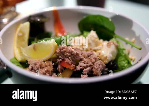 Salad with canned tuna, tomatoes, peanuts, mango, avocado, celery ...