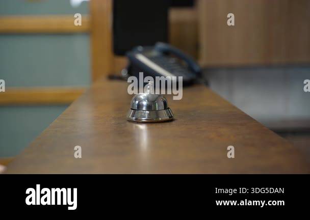 Guest handing over a room key card to the male receptionist at the ...