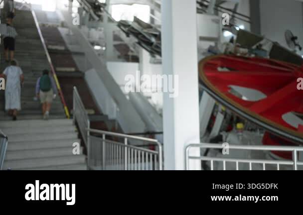 Blurred cable car station interior showing stairs, railings and ...
