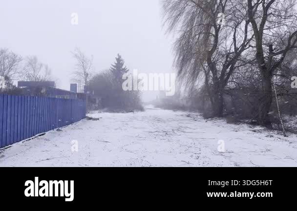 Snow blizzard in small village. dangerous weather. High quality 4k ...