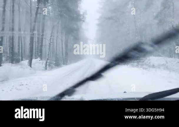 Driving through snow storm or blizzard. Winter POV from car. High ...