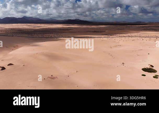 Aerial view shows golden dunes, turquoise Atlantic surf, Corralejo ...