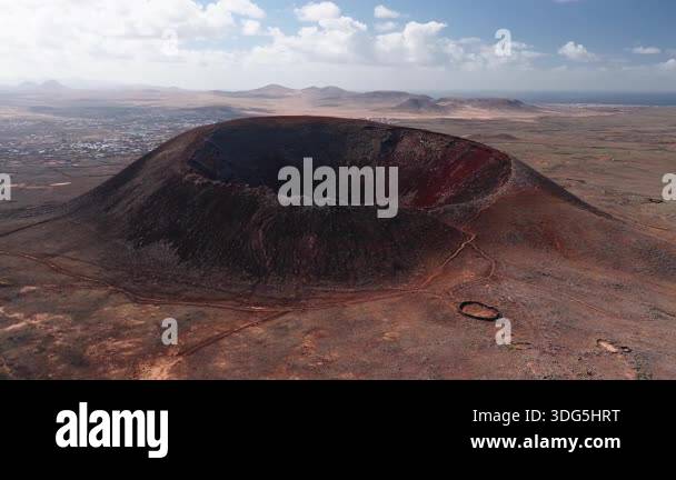 Aerial view shows Calderon Hondo crater with red black walls, scoria ...