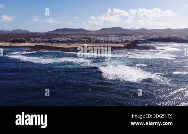 Aerial view of Fuerteventura town, whitewashed hotels and homes meet ...