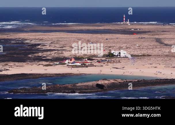 Aerial view of Fuerteventura in Canary Islands shows striped lighthouse ...