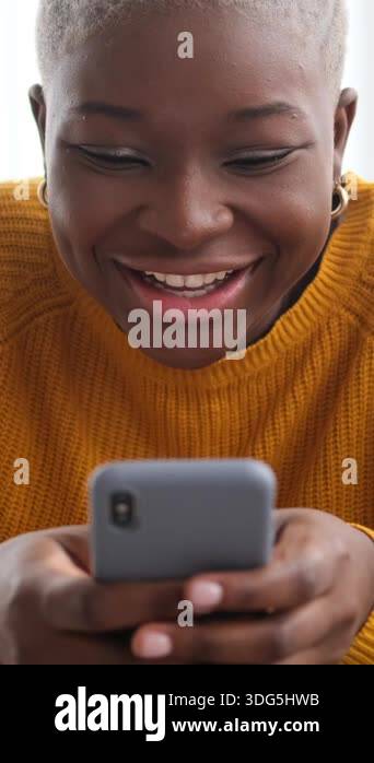 Vertical video of a happy Black woman with short hair smiling and ...