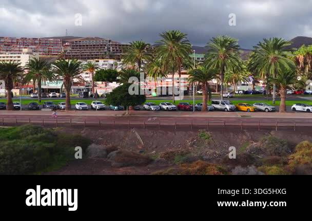 Aerial view of Fuerteventura promenade with MANGO storefront, terraced ...