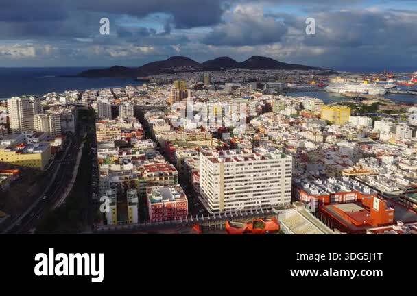 Aerial view of Las Palmas de Gran Canaria shows grid rooftops, Puerto ...