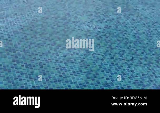 Footage of clean blue swimming pool water with gentle ripples and ...