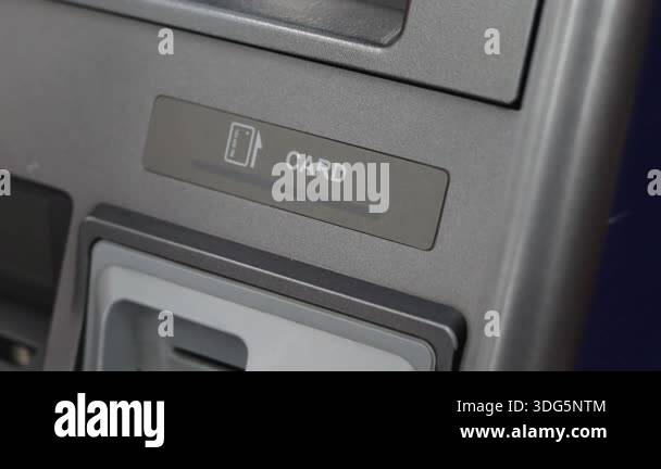 Macro shot of ATM card slot with natural light, copy space illustrating ...