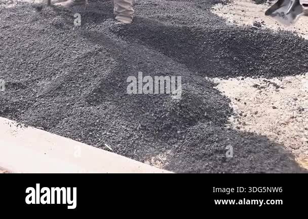 October 14 2025 New York USA Several workers use shovels to spread ...