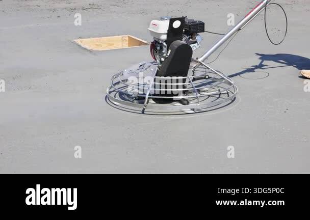 October 14 2025 New York USA Power trowel machine smooths freshly ...