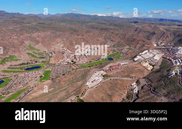 Aerial daylight sweep over Gran Canaria near Salobre, Maspalomas, and ...