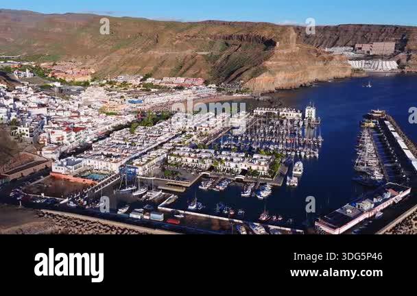 Aerial daylight view of Puerto de Mogan, Gran Canaria. Whitewashed ...