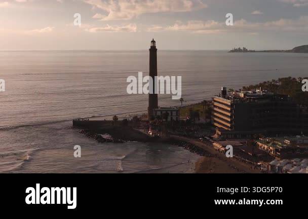 Aerial 4K view of Maspalomas Lighthouse in Gran Canaria at sunset ...